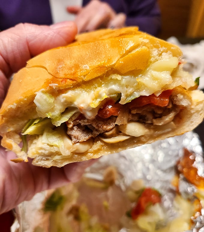 The steak sub isn't just a sandwich &ndash; it's a handheld festival of meat, veggies, and melted cheese worth every napkin.