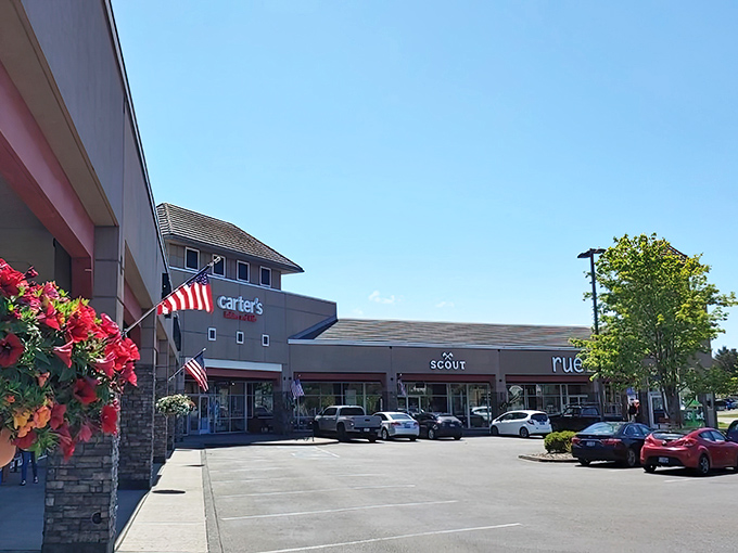 Multiple storefronts stretch across the complex like a retail buffet offering something for everyone's taste.