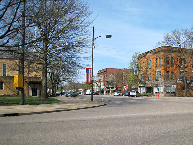 Early spring in Dover reveals the bones of downtown before the trees leaf out. American flags flutter proudly against historic brick buildings dating back generations.