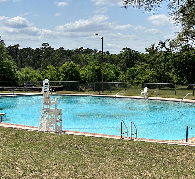 The swimming pool that saved countless Texans from summer meltdowns since the 1930s. No fancy infinity edges needed when you've got pine-framed perfection.