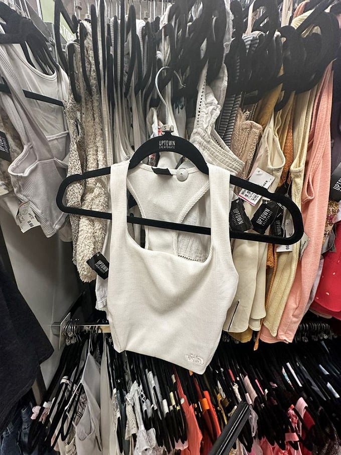 Summer essentials hanging in pristine formation. That white tank is the blank canvas your wardrobe has been begging for.