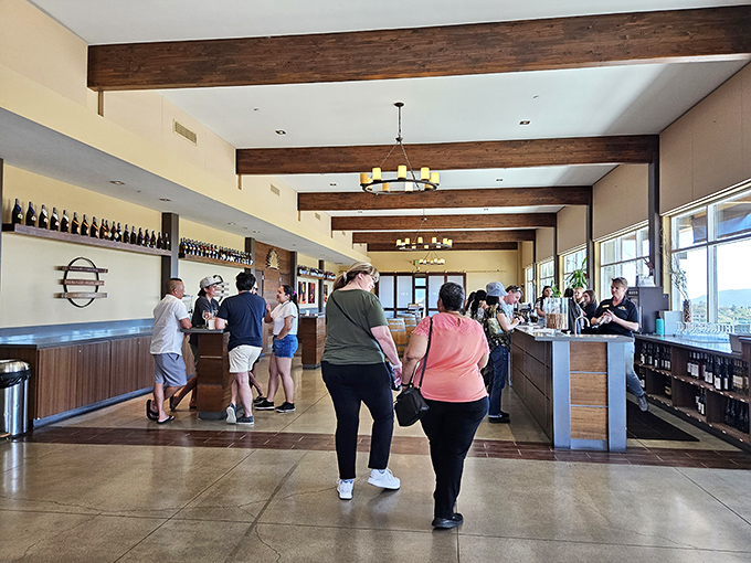 Modern rustic elegance defines the tasting room, where exposed beams and natural light create California's answer to Tuscan hospitality.