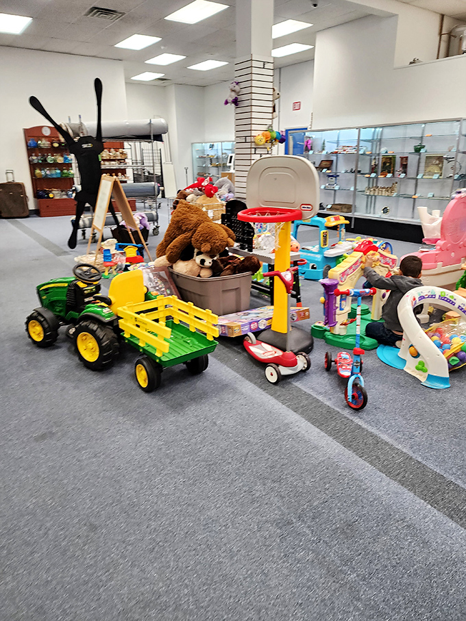 Childhood dreams park themselves in the toy section, where plastic tractors and teddy bears await new adventures.