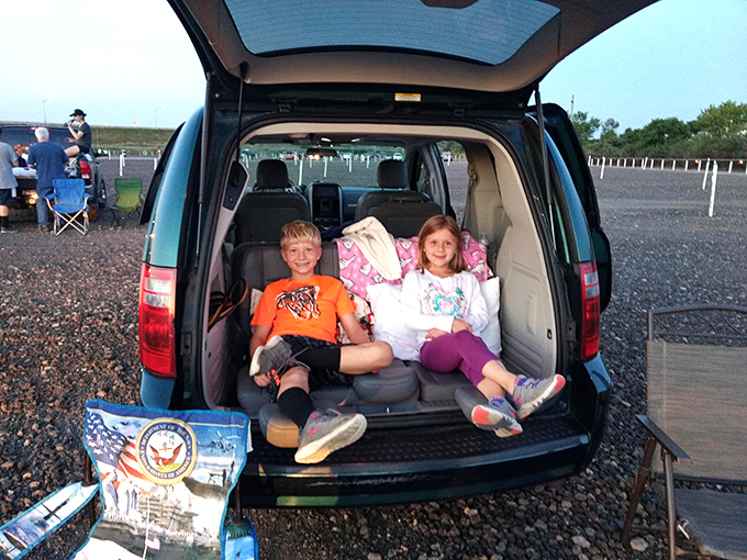 Some families elevate the drive-in experience to an art form, transforming SUV trunks into cozy nests of blankets and anticipation.