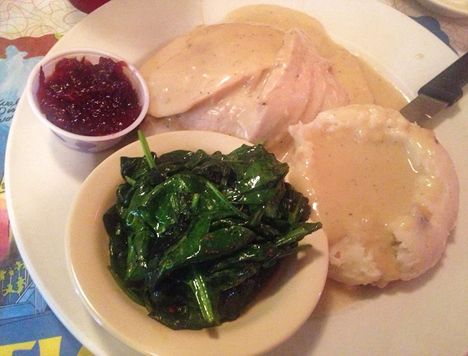 Thanksgiving on a plate, minus the awkward family conversations. That gravy could make cardboard taste good, but thankfully it's coating real turkey instead.