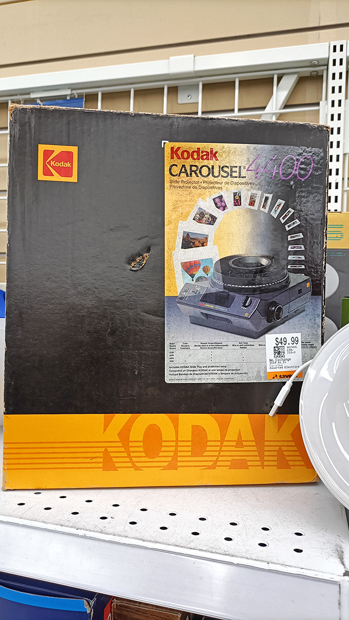 Remember slide projectors? This boxed Kodak Carousel isn't obsolete technology—it's vintage nostalgia waiting for its hipster resurrection.