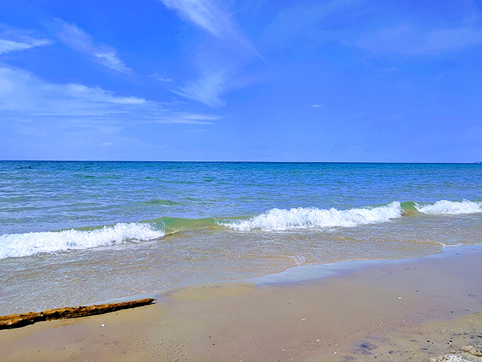 Waves that whisper rather than roar. Lake Michigan showing its gentle side with colors that would make a peacock jealous.