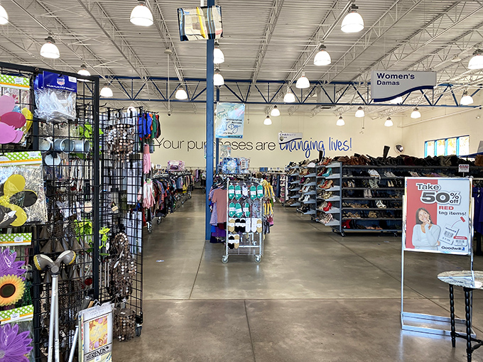 "Your purchases are changing lives!" proclaims the wall, while shoppers navigate a sea of possibilities. Retail therapy with actual therapeutic benefits.