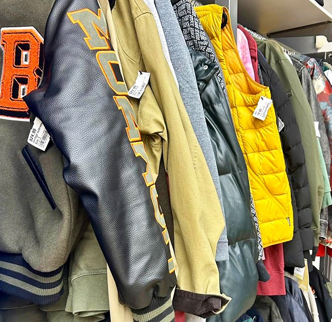 Varsity jackets and puffer coats hanging like a team of fashion all-stars. Winter layers with previous lives but plenty of warmth left to give.