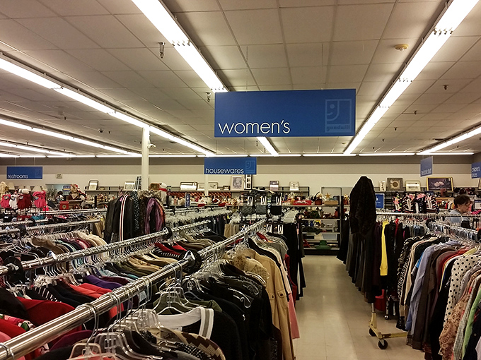 Fashion democracy in action. Designer labels mingle with everyday brands under the blue "women's" sign, all priced for real-world budgets.