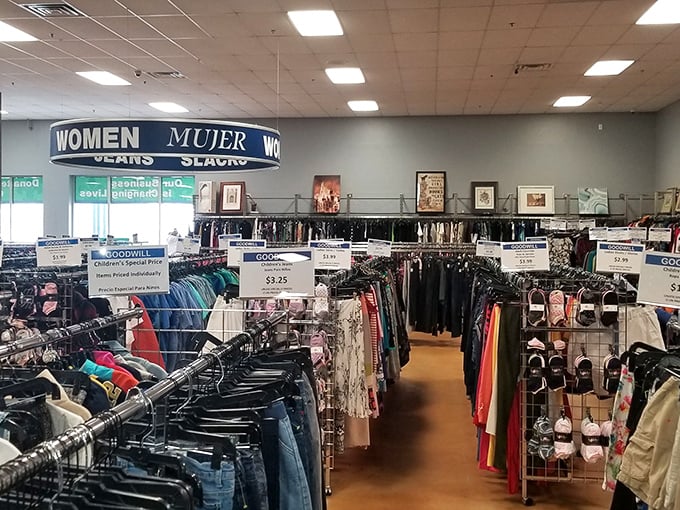 The women's section stretches toward the horizon like a fashion frontier. Those price signs aren't typos&mdash;they're invitations to reinvent your wardrobe.