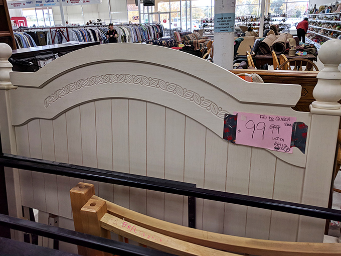A wooden headboard fit for royalty, or at least someone who dreams of breakfast in bed every Sunday.