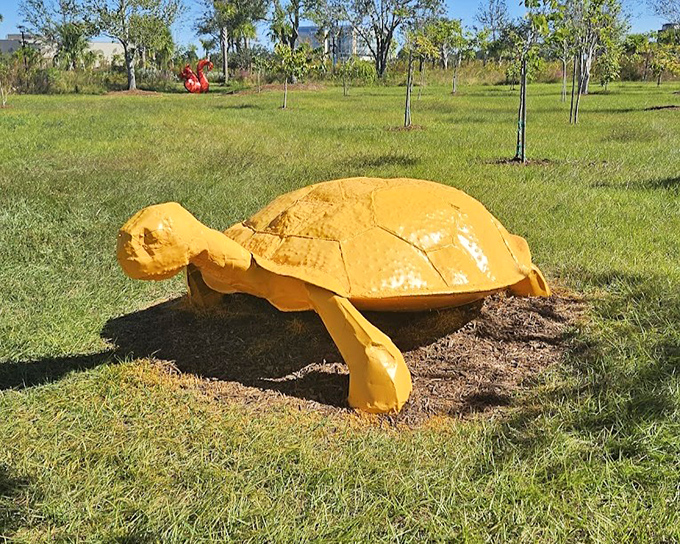 This sunny yellow turtle seems to be taking Florida's "slow living" philosophy to heart, bringing a splash of cheerful color to the garden landscape.