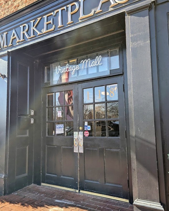 The elegant glass doorway beckons downtown browsers into a vintage mall where Main Street charm meets timeless shopping pleasure.