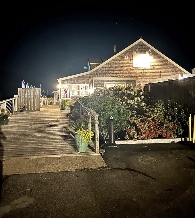 BREAKWATER's nighttime glow transforms this Stonington gem into a beacon for hungry travelers seeking seafood salvation.