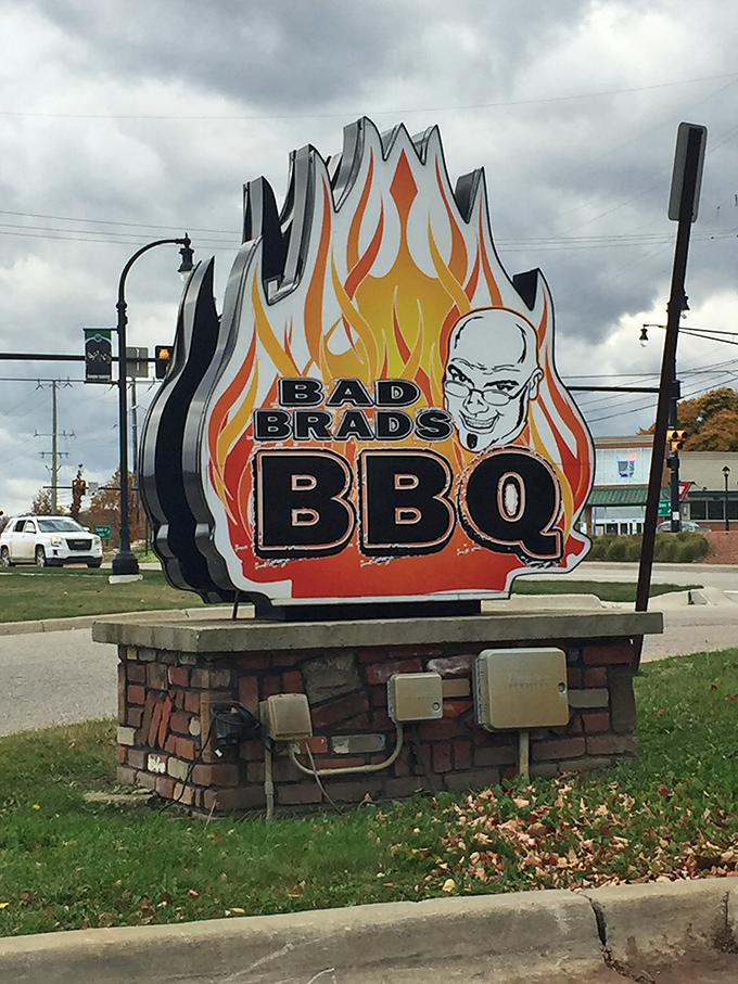 Bad Brads' flaming sign is impossible to miss &ndash; like a bat signal for BBQ enthusiasts cruising through Orion Township.