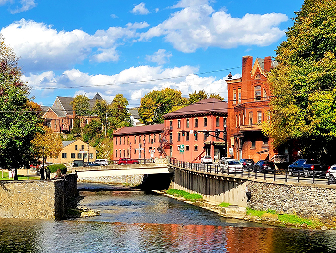 Red brick mills and flowing water create an industrial symphony that sings of Pennsylvania's hardworking heritage.