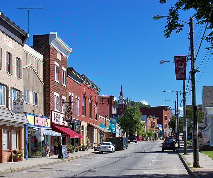 Berlin&rsquo;s church steeple watches over a quiet main street lined with classic New England charm.