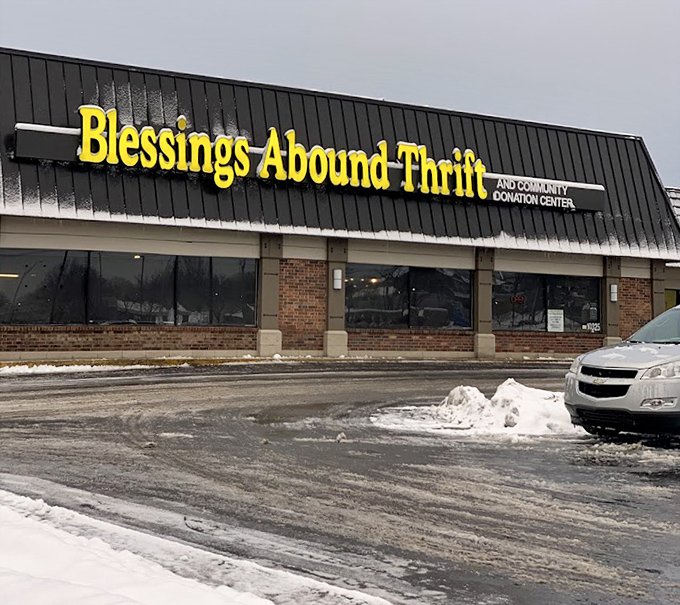 Blessings Abound indeed! That cheerful yellow sign brightens even snowy days for dedicated thrift hunters.