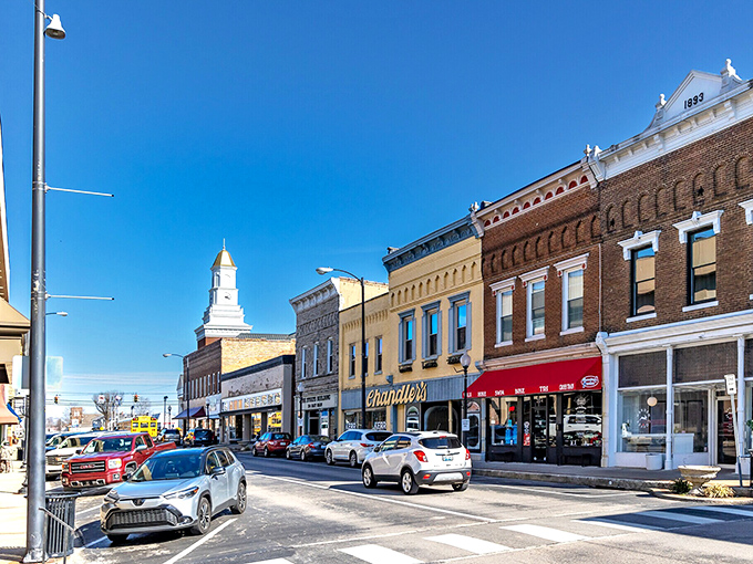 That church steeple playing peekaboo with Campbellsville's colorful storefronts! Like Main Street USA got a fresh coat of affordable charm.