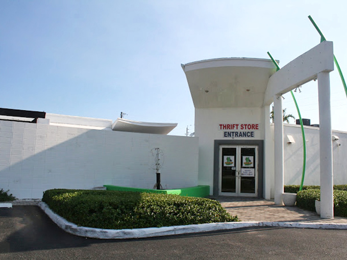 Charity Thrift's modern entrance design suggests organized shopping where finding great deals doesn't require archaeological excavation skills.