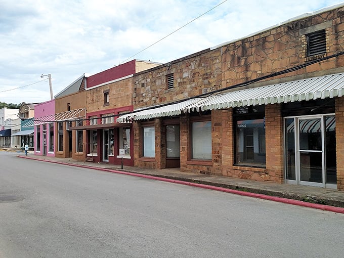 Clinton's historic storefronts stand like sentinels of simpler times, their stone facades telling stories of generations past. Small-town America preserved.
