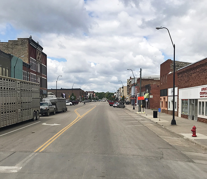 Livestock and limestone! Concordia's cloud-kissed main drag showcases the perfect marriage of farming practicality and historic architectural flair.