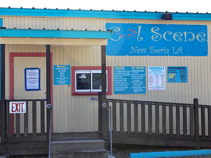 The blue sign and wooden porch say "small-town charm," but the menu promises big-time flavor.