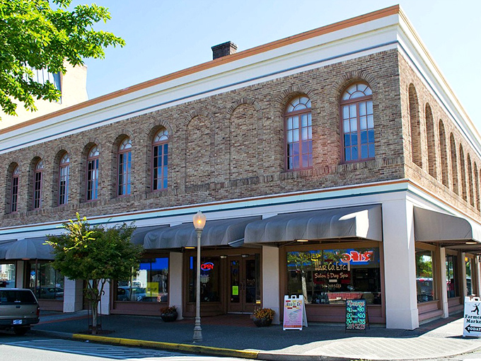 Coos Bay's historic brick building stands like a well-preserved time capsule. Those arched windows have witnessed decades of affordable living!