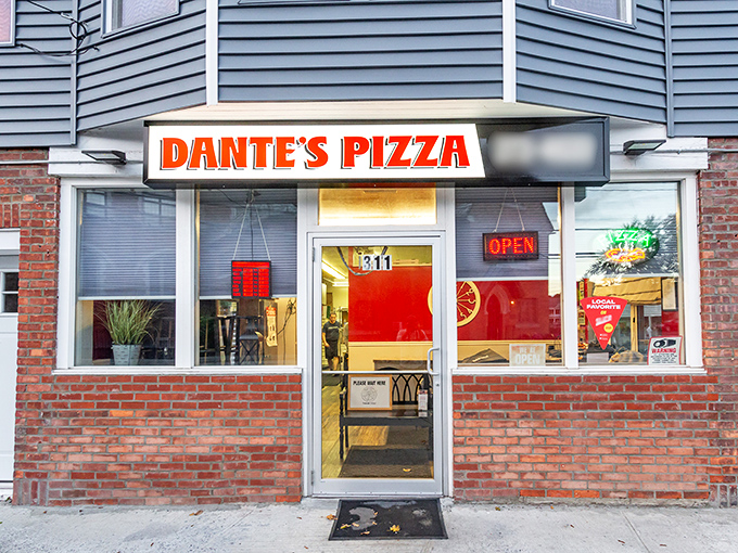 Dante's bright orange sign pops against the blue siding like a pizza fresh from the oven. This corner spot has "neighborhood institution" written all over it.