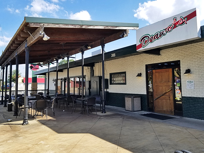 Deano's rustic charm and wooden patio create the perfect pizza hangout spot. That water tower in the background? Just keeping watch over pizza perfection.