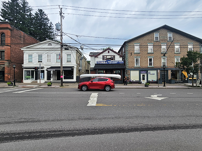 Delhi's hilltop church tower watches over a community where college culture meets retirement-friendly affordability in perfect harmony.