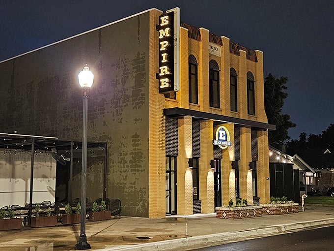 Empire's historic brick building stands like a monument to pizza perfection. When night falls, that vertical sign transforms into OKC's coolest pizza invitation.