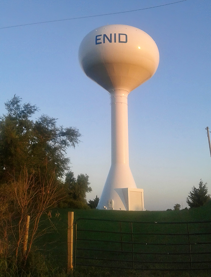Enid's iconic water tower stands tall against the Oklahoma sky, a beacon of small-town pride and big-hearted community spirit.