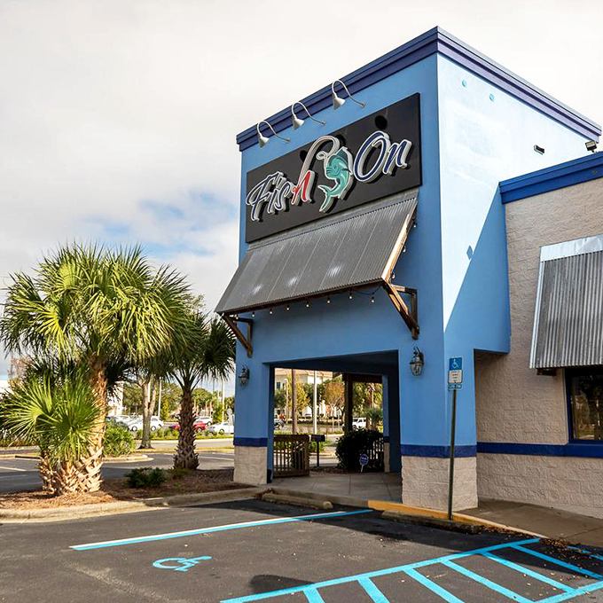That bold blue building houses seafood treasures! Fish On's vibrant exterior hints at the fresh flavors waiting inside.