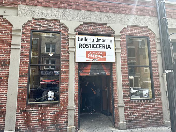 Galleria Umberto's unassuming entrance hides Boston's best-kept Sicilian pizza secret. Blink and you'll miss it!