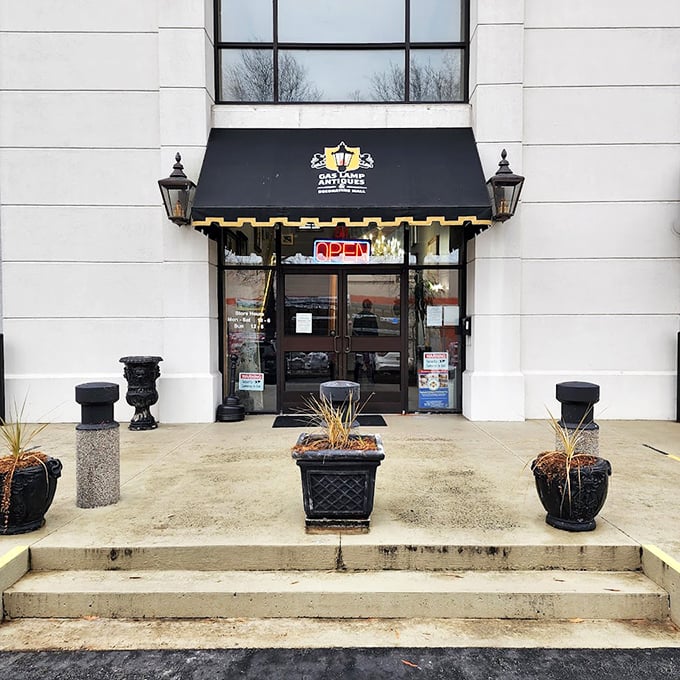 Elegant storefront with classic awning suggests sophisticated antique shopping - this isn't your grandmother's dusty attic experience.