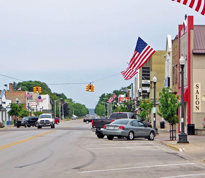 American flags flutter along Gladstone's main street, where patriotism runs high and housing costs stay remarkably low.