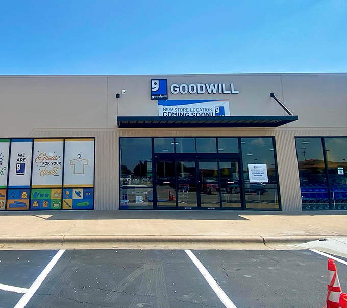 The modern Goodwill facade gleams with promise, where the outlet model turns thrift shopping into an archaeological dig with incredible rewards.