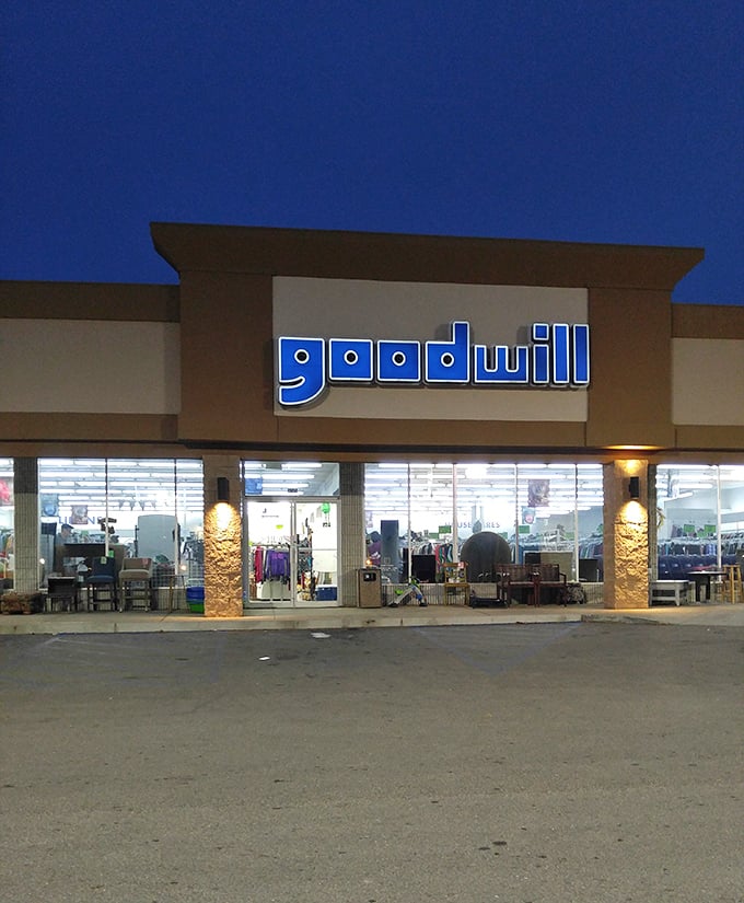 Goodwill's illuminated sign glows like a beacon in the night, guiding bargain hunters to their happy place.