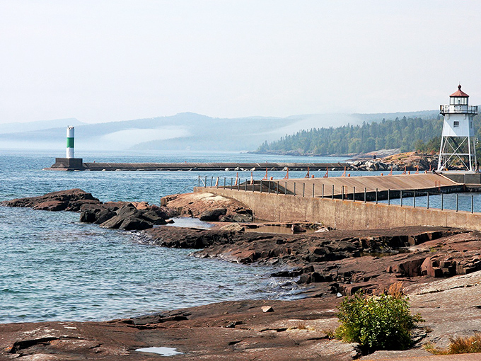 Grand Marais' lighthouse stands guard over Lake Superior's waters. Nature's majesty comes free with every affordable home purchase here!