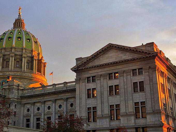 The stately dome of Harrisburg's Capitol building catches golden hour light. Pennsylvania's architectural heritage shines in every ornate detail.