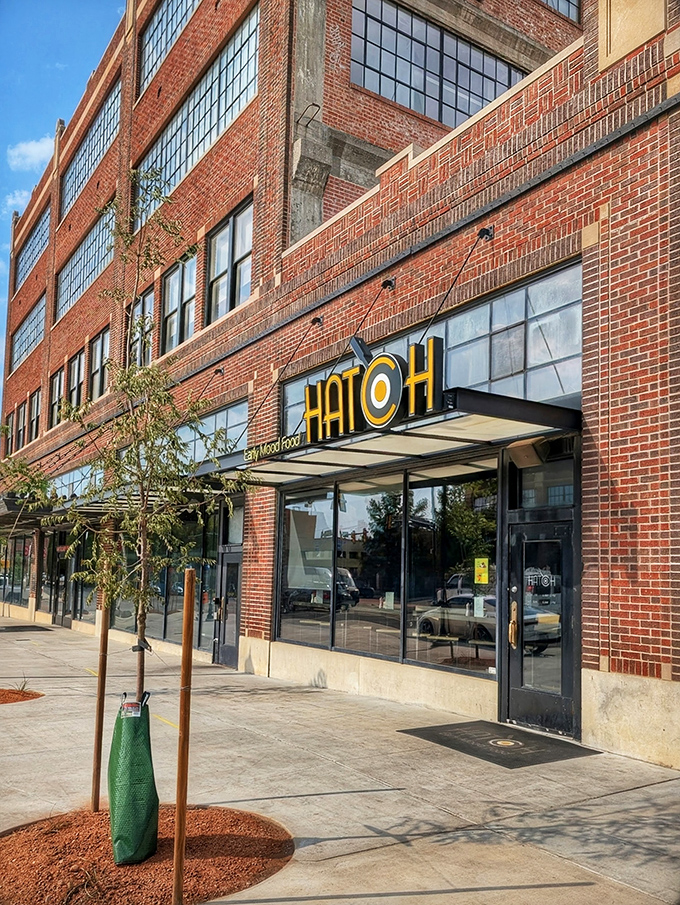 Hatch's bold signage pops against historic brick&mdash;a modern breakfast statement in Oklahoma City's urban landscape.