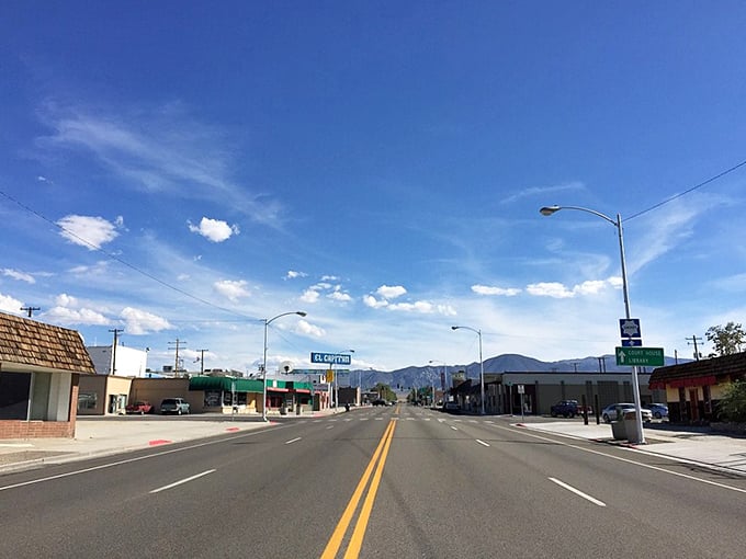 Hawthorne's downtown stretches toward distant mountains, offering budget-friendly businesses along the journey.