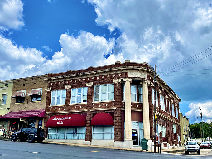 Lake life meets small-town charm where brick buildings house shops and restaurants welcoming weekend adventurers seeking Greers Ferry.