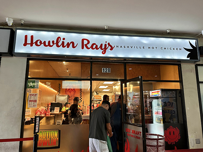 Howlin' Ray's glowing storefront at night &ndash; where Nashville hot chicken dreams and LA food culture collide deliciously.