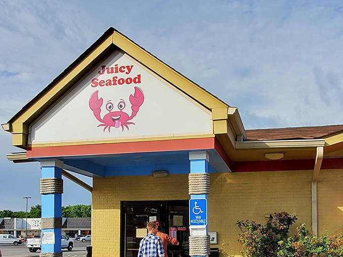 Juicy Seafood (entrance): "Seafood with a smile! That cheerful cartoon crab practically guarantees a good time is waiting inside this bright yellow building."