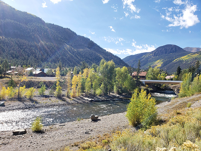 The river running through Lake City reflects golden aspens and mountain views &ndash; nature's mirror showing off Colorado's best angles.