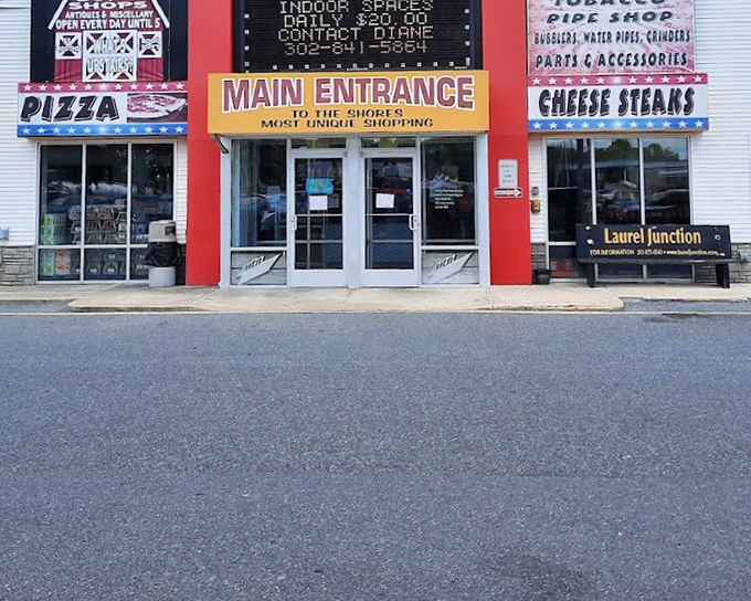 Bold signage announces your arrival to shopping paradise where pizza fuels serious bargain hunting sessions.