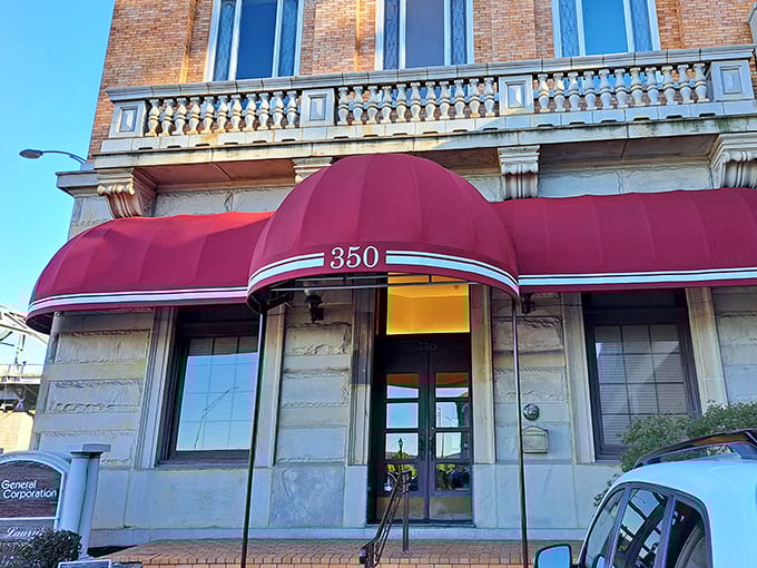 Laury's classic red awning signals you've arrived somewhere special—a Charleston institution where river views complement exquisite steaks.